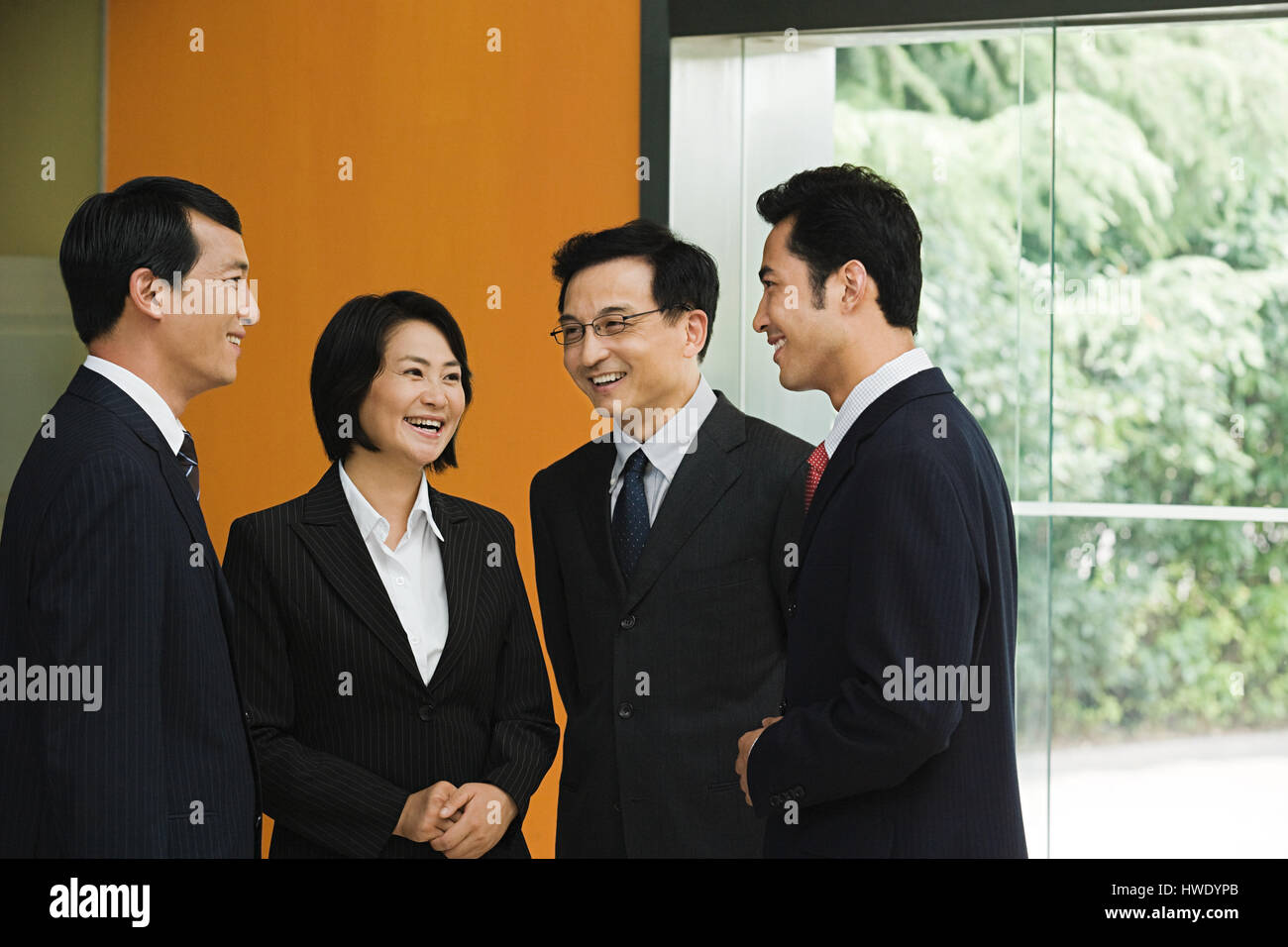 Four Chinese business colleagues Stock Photo - Alamy