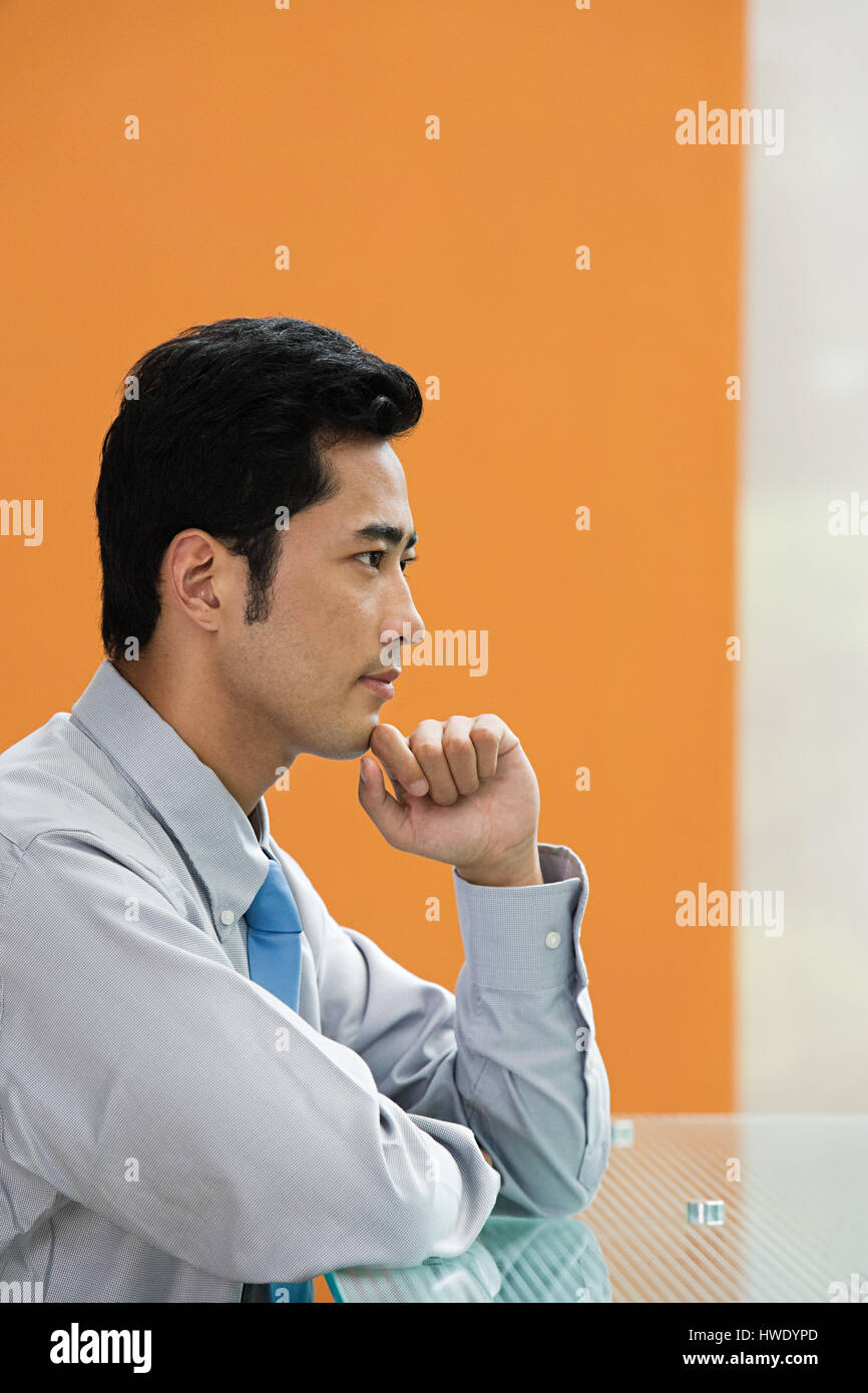 Serious looking young businessman Stock Photo - Alamy