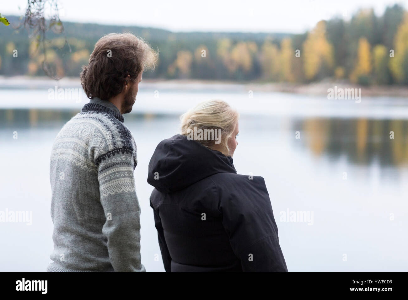 Couple Enjoying The Lake View From Campsite Stock Photo - Alamy