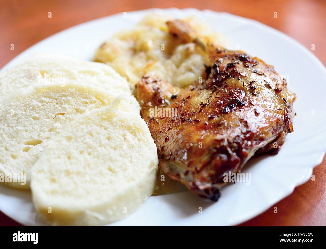 Baked Duck Leg with Dumplings and Stewed White Cabbage Stock Photo - Alamy
