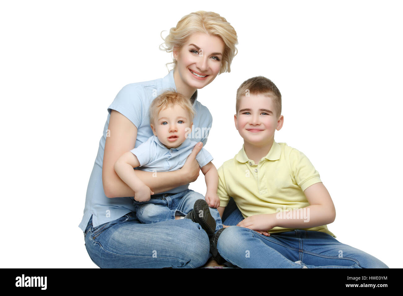 Young beautiful happy mother with two sons. Isolated over white ...