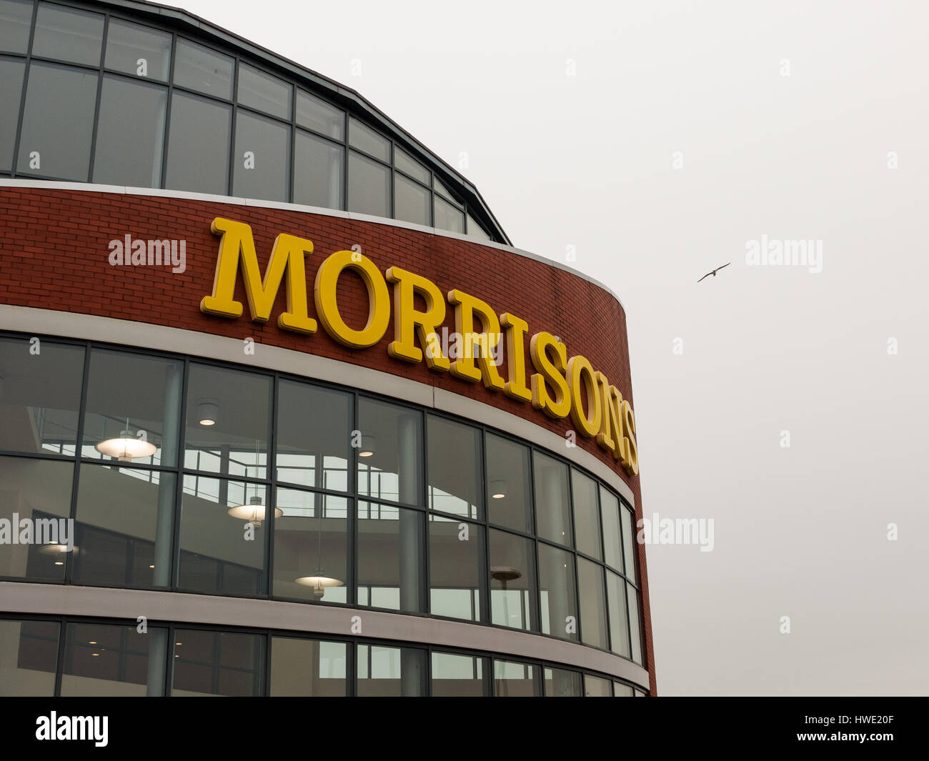 The outer facade of a Morrisons supermarket on an overcast winter day ...