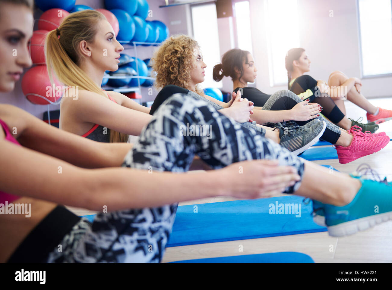 Women doing abdominal training in the studio Stock Photo - Alamy