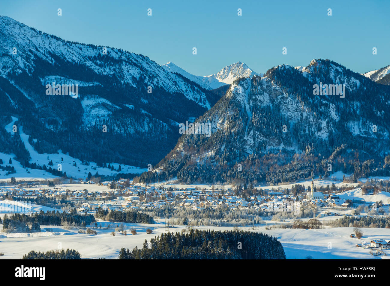 View of German village and Alps in winter from Eisenberg Castle Stock ...