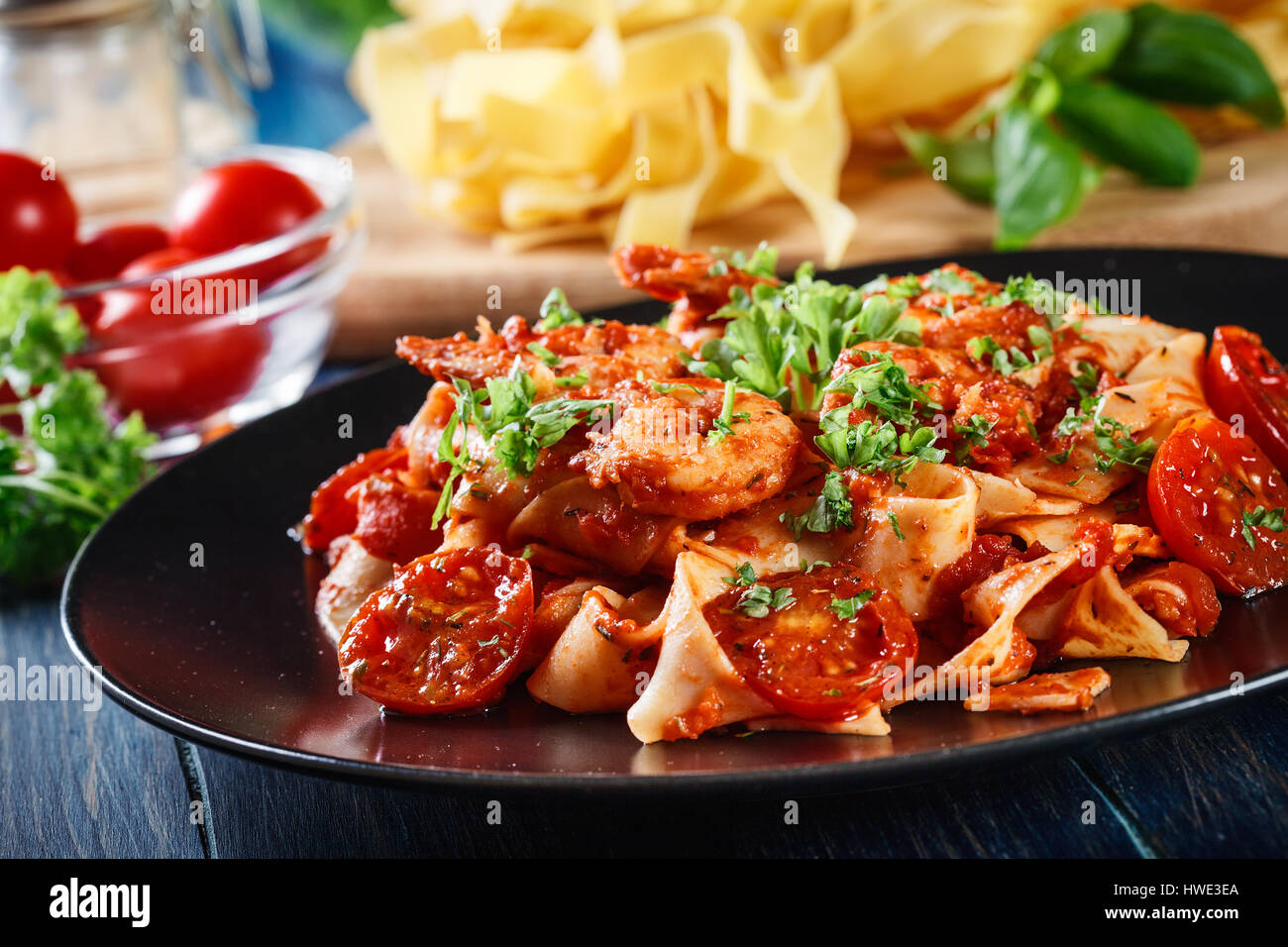 Pappardelle pasta with seafood tomatoes sauce hi-res stock photography ...