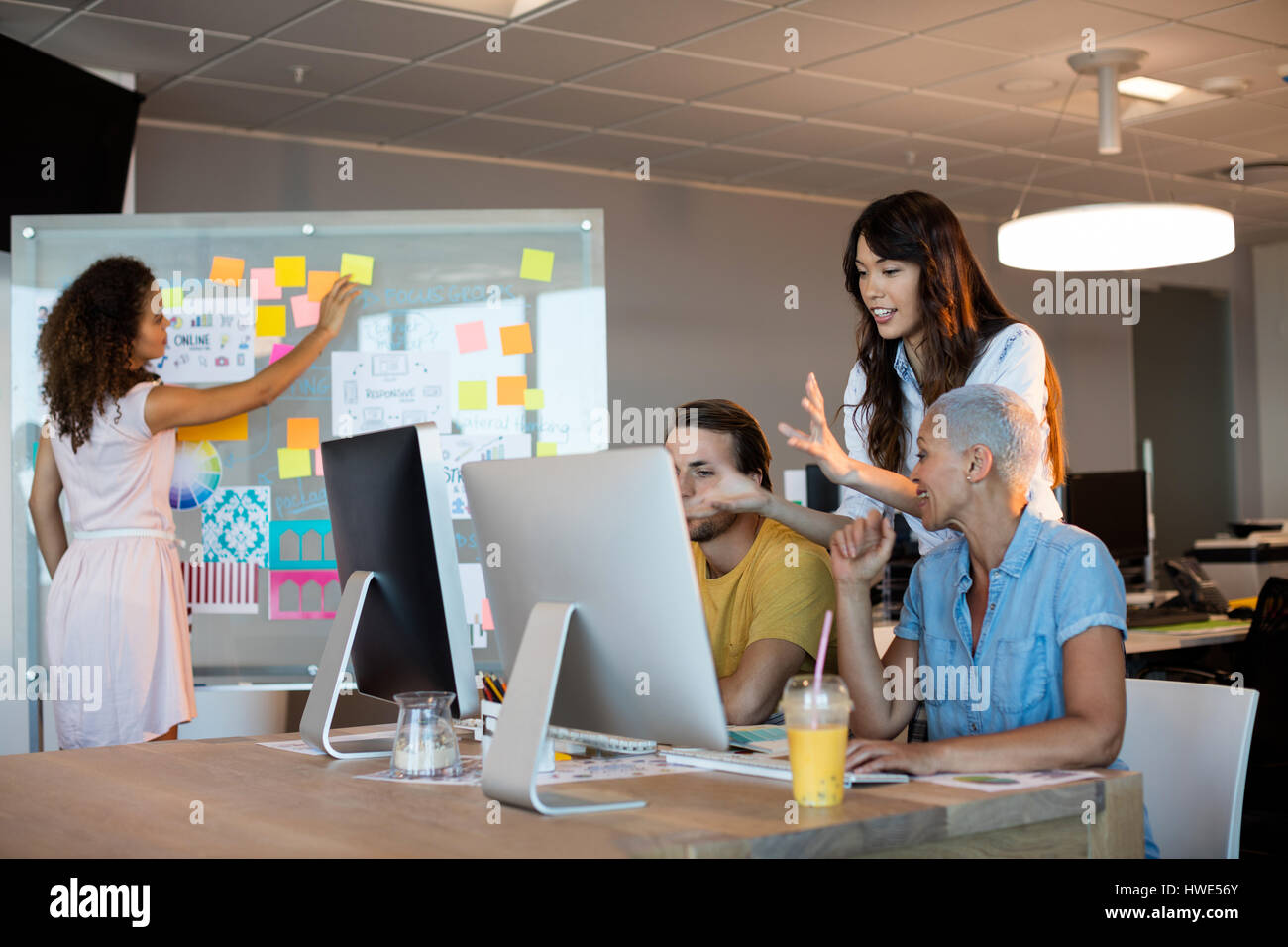 Creative business team working together at office Stock Photo - Alamy