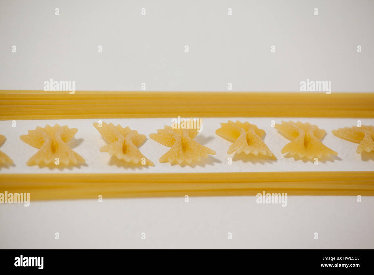 Varieties of pasta arranged on white background Stock Photo - Alamy
