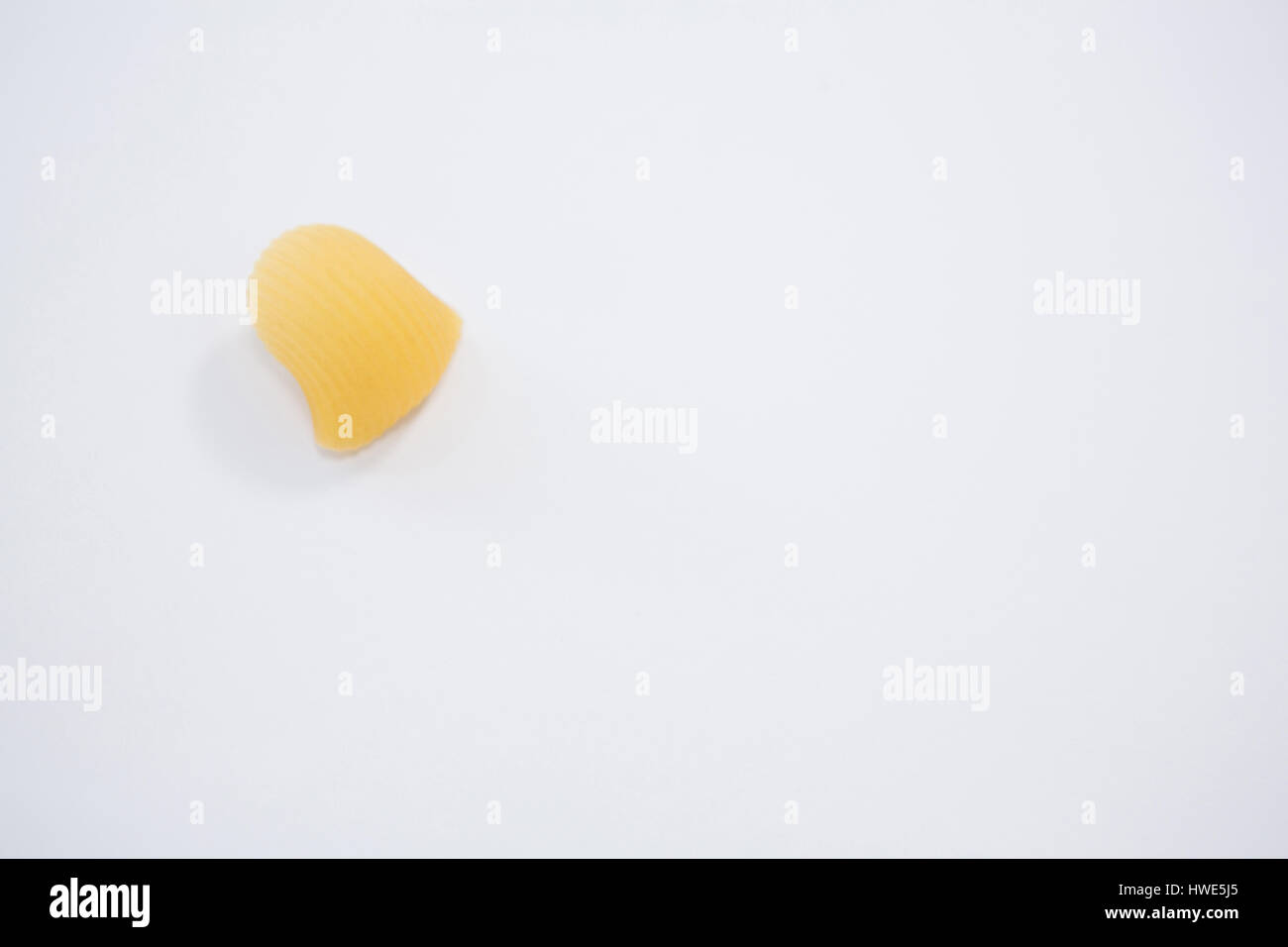 Lumache rigate pasta isolated on white background Stock Photo - Alamy