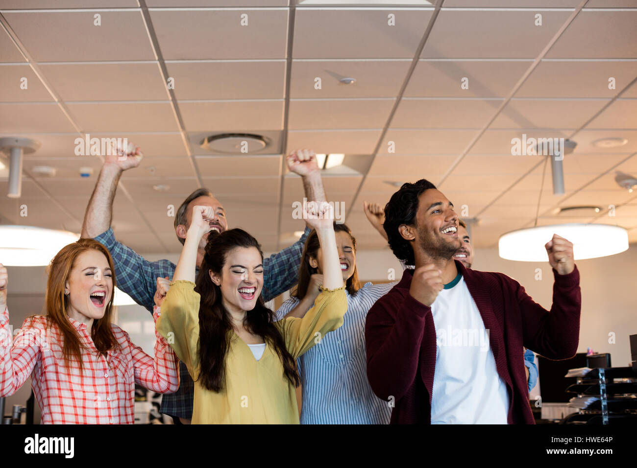 Happy creative team celebrating hi-res stock photography and images - Alamy