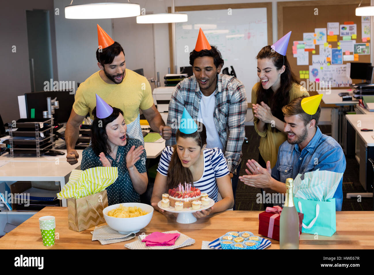 Creative business team celebrating colleagues birthday in office Stock ...