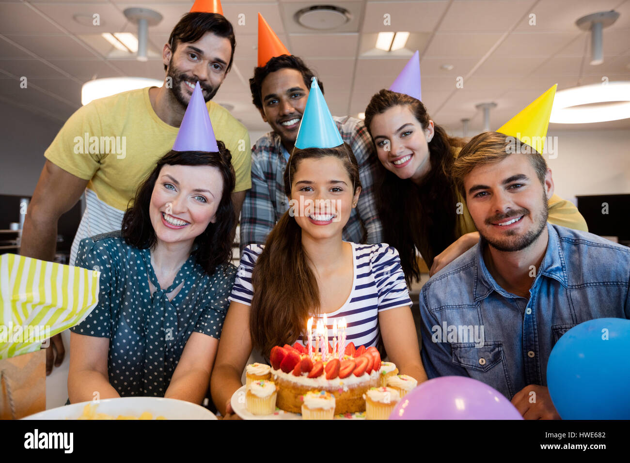 Creative business team celebrating colleagues birthday in office Stock ...