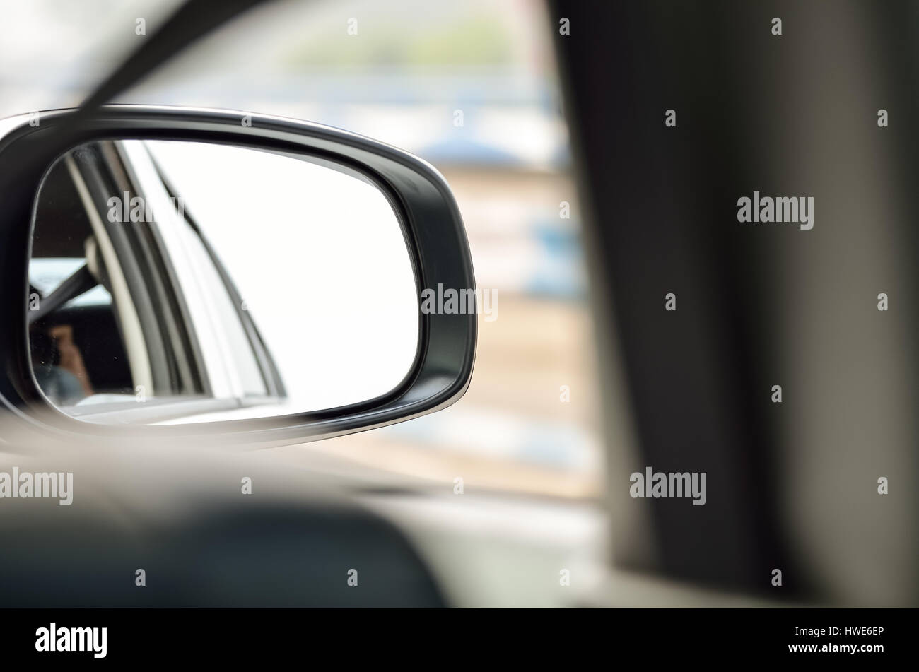 Rear view mirror reflecting car Stock Photo - Alamy