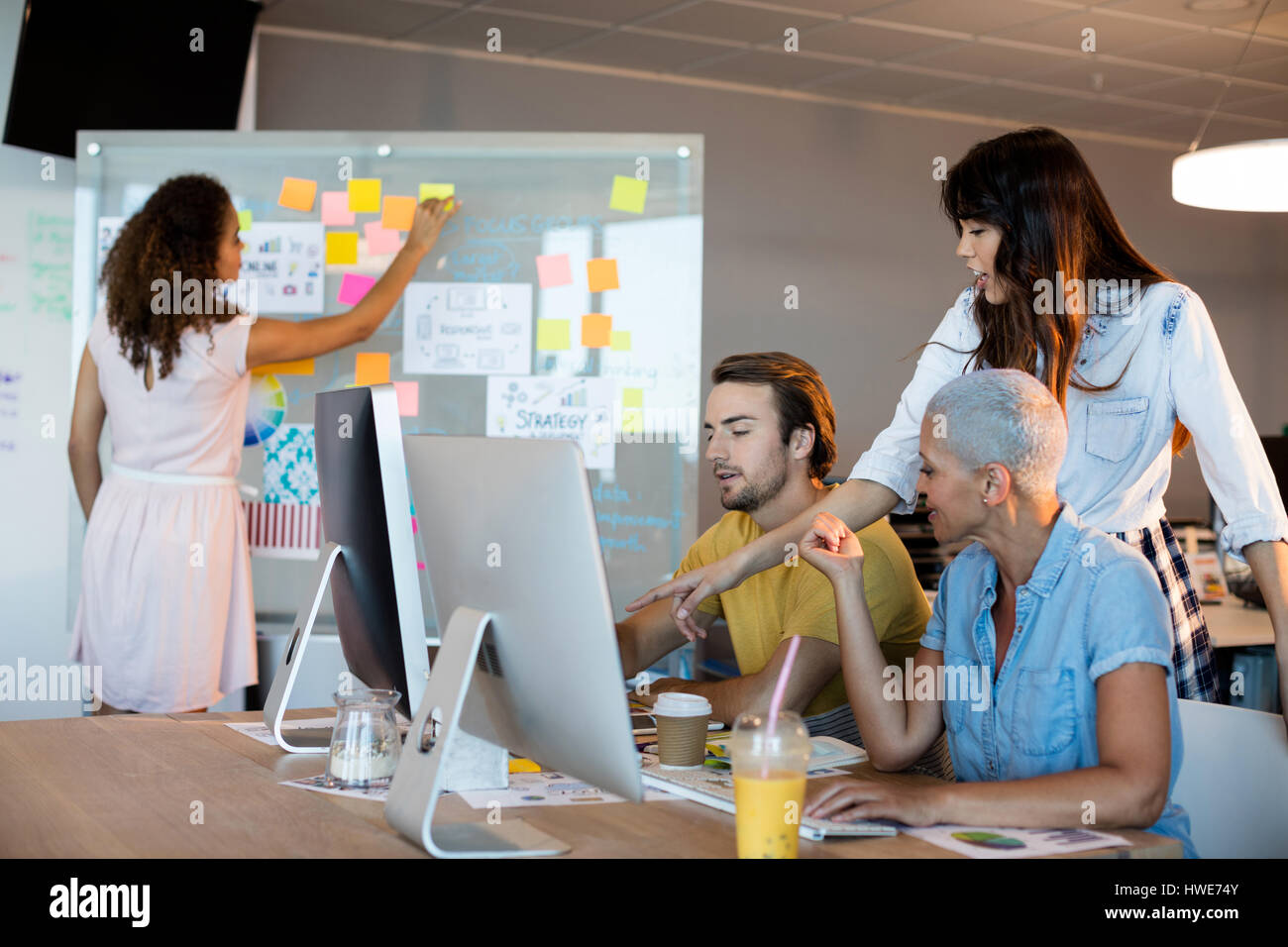 Creative business team working together at office Stock Photo - Alamy