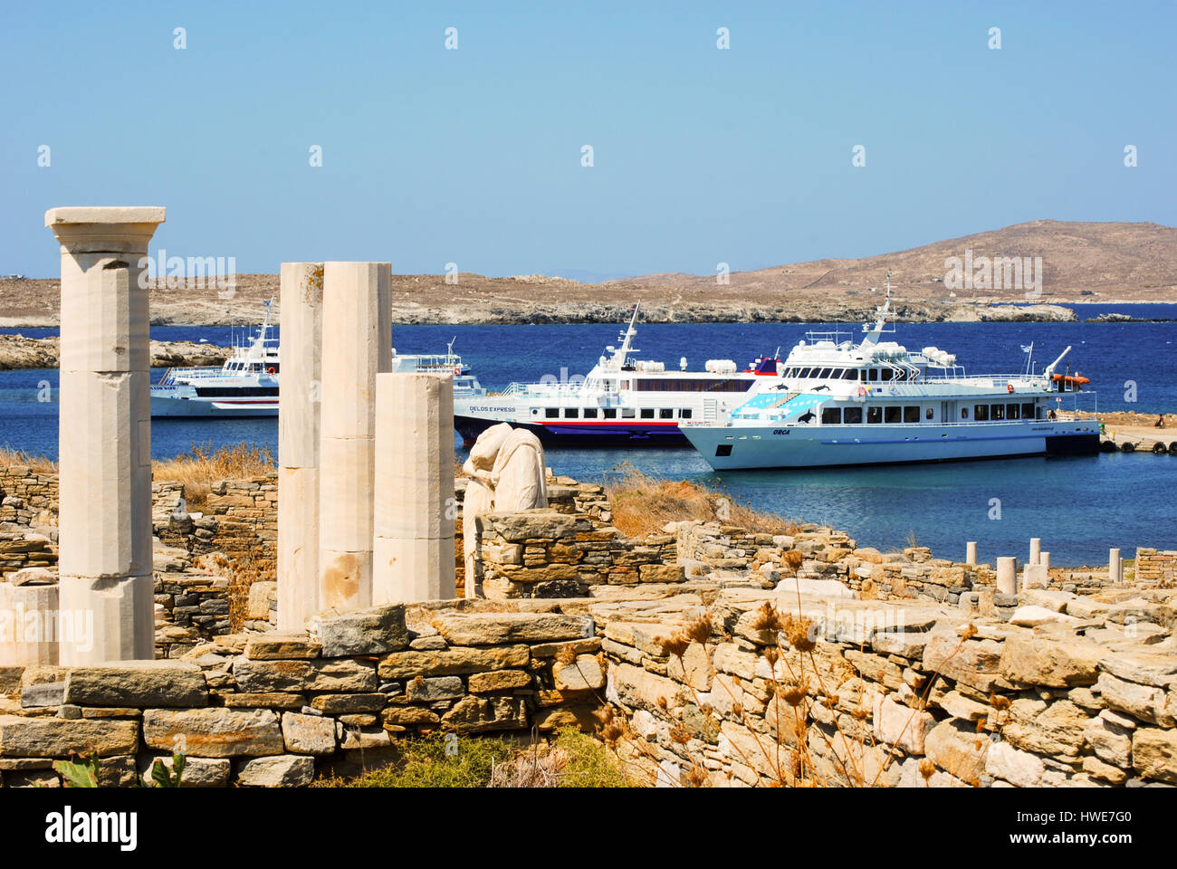 Visiting tour boats at the small port on the mythological island of ...