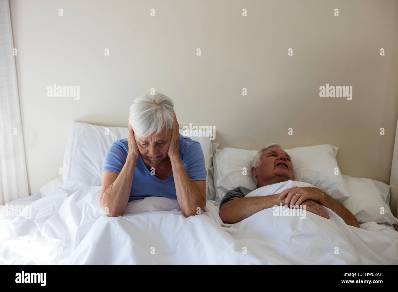 Man woman bed awake snore hi-res stock photography and images - Alamy