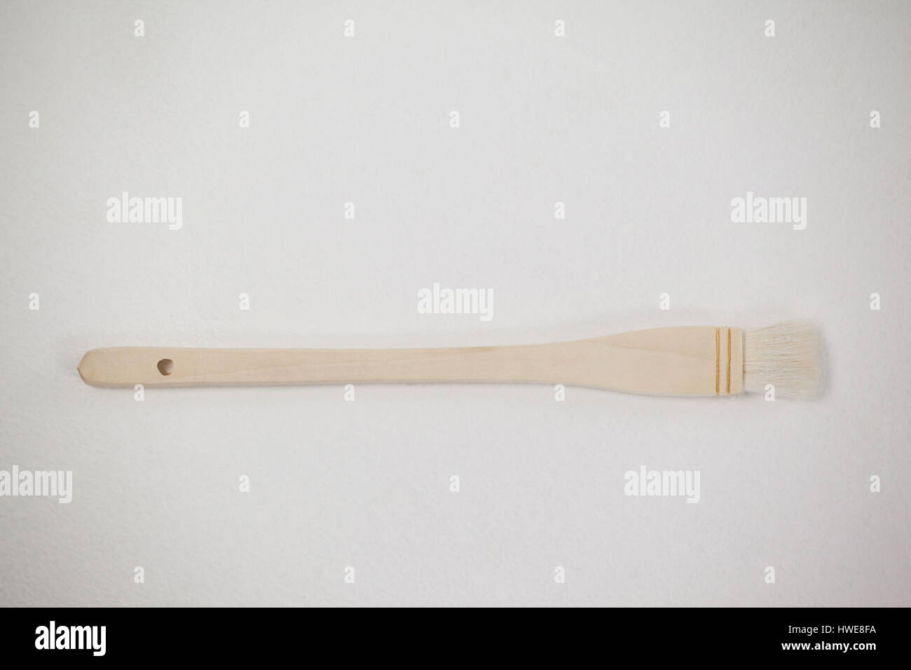 Close-up of flat paint brush against white background Stock Photo - Alamy