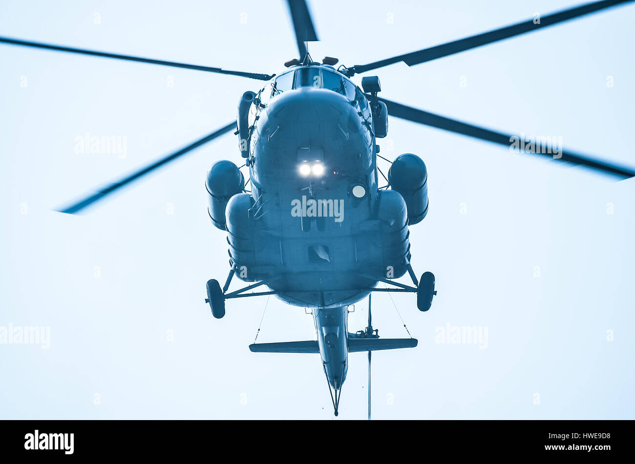 Photograph of a helicopter capture from below of it Stock Photo - Alamy