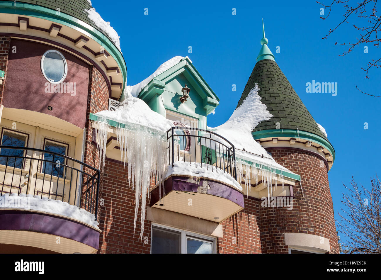 Big icicles and snow hanging from the roof in Montreal Stock Photo - Alamy