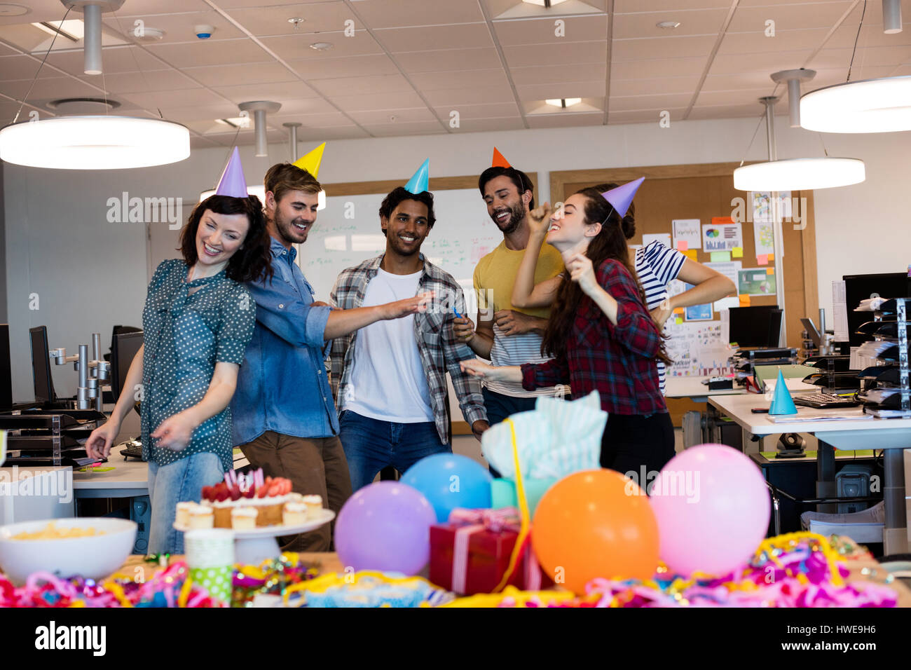Creative business team dancing together at office Stock Photo - Alamy