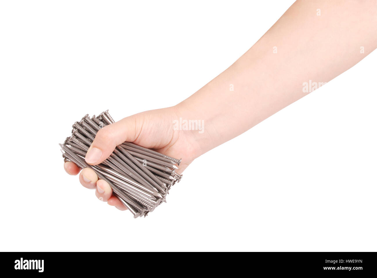 Man's hand holding metal nails. Closeup with clipping path isolated on ...