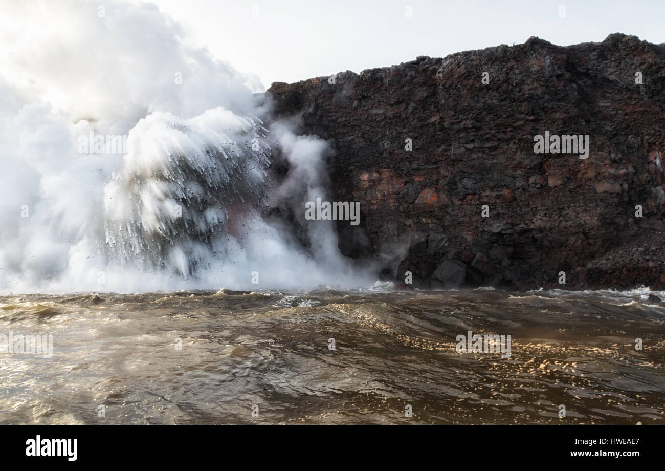 Large explosions occur as hot lava flows into cold sea water ...