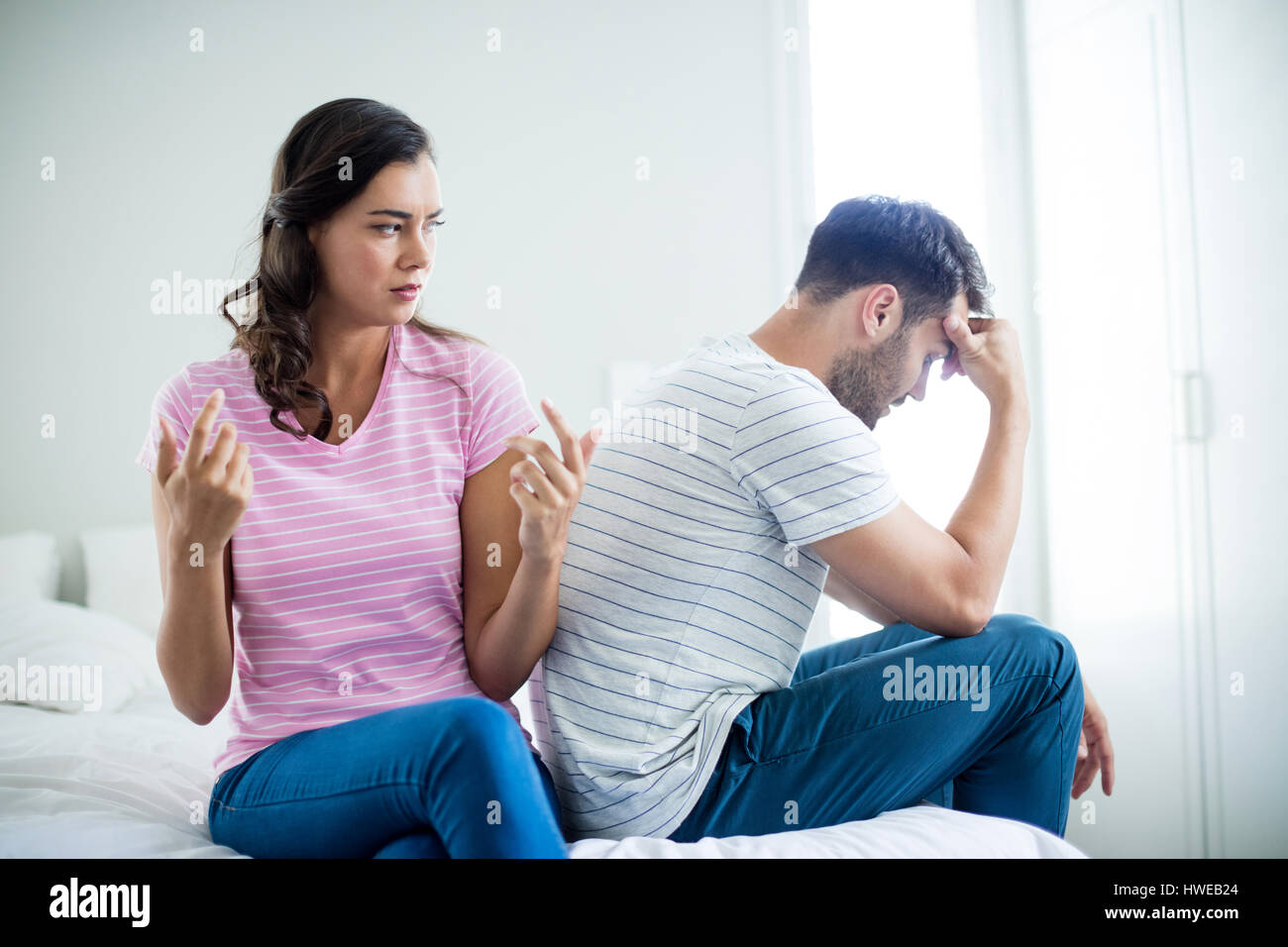 Couple arguing with each other in bedroom at home Stock Photo - Alamy