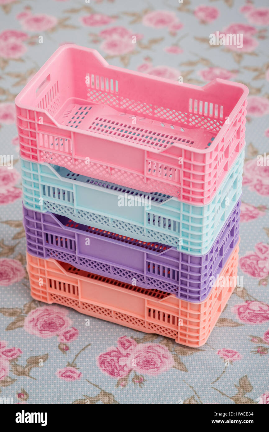 Set of small plastic boxes on colorful table cloth Stock Photo - Alamy