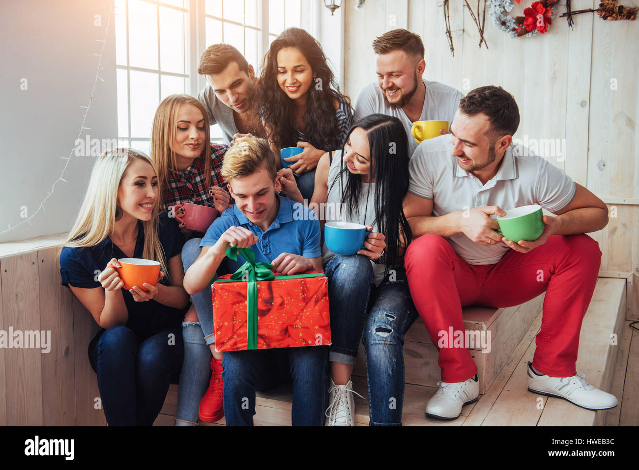 Group of best friends at party. smiling and cheerful people sitting on ...