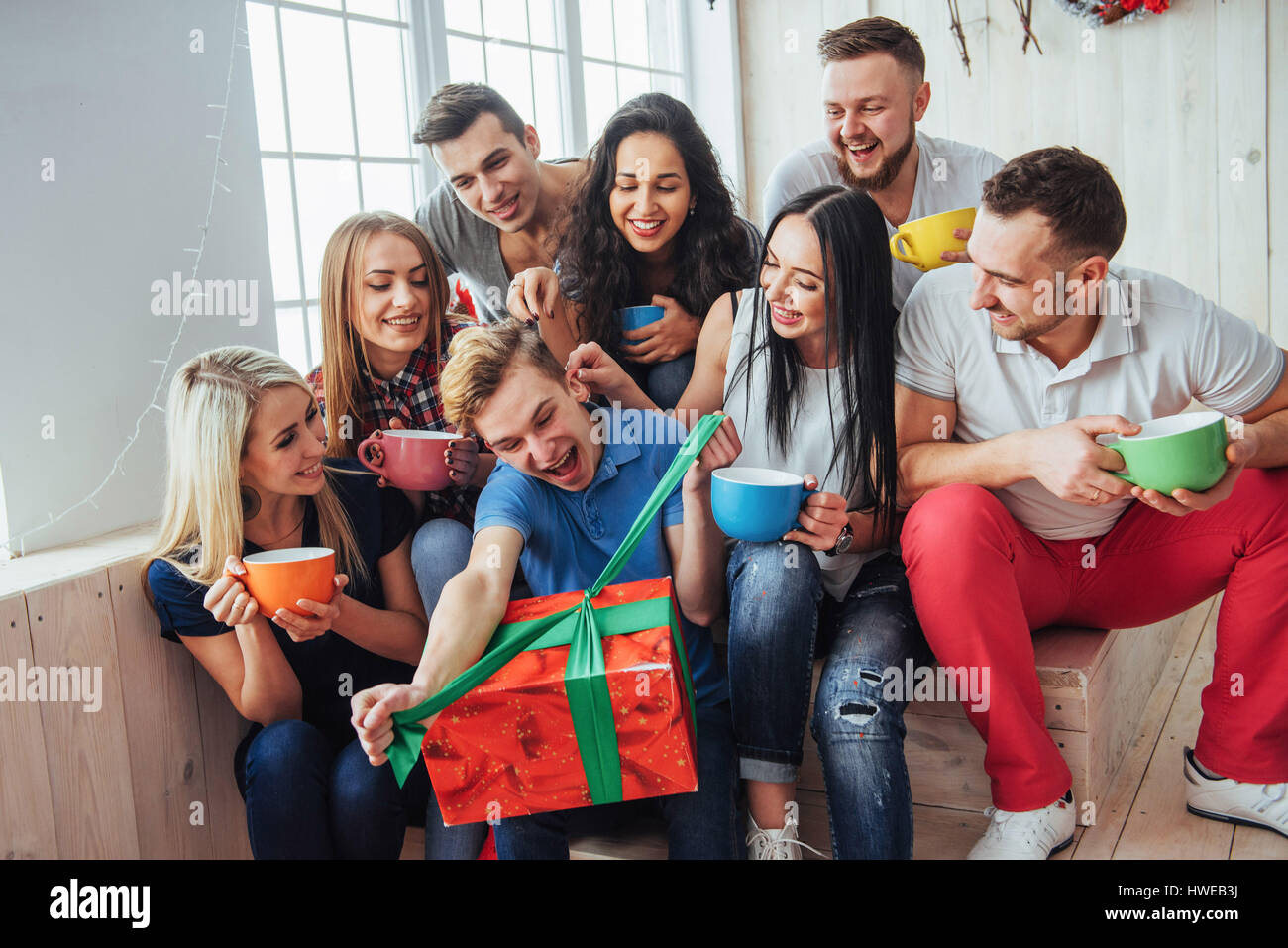 Group of best friends at party. smiling and cheerful people sitting on ...