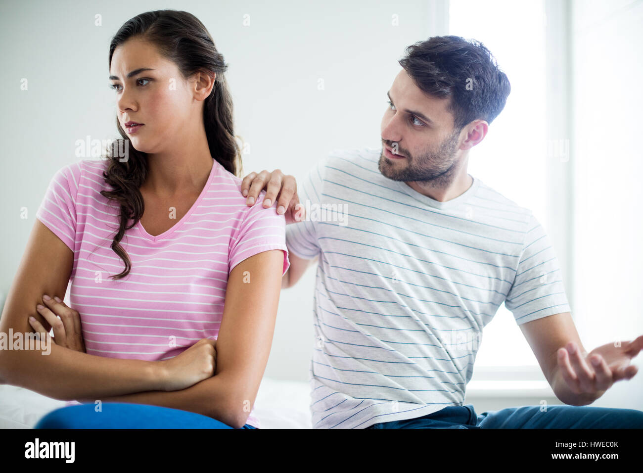 Couple arguing with each other in bedroom at home Stock Photo - Alamy