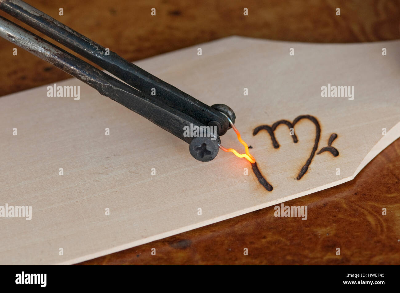Burning Drawing on a Wooden Surface Stock Photo - Alamy