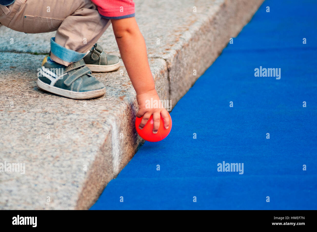 Hand with Red Ball Stock Photo - Alamy