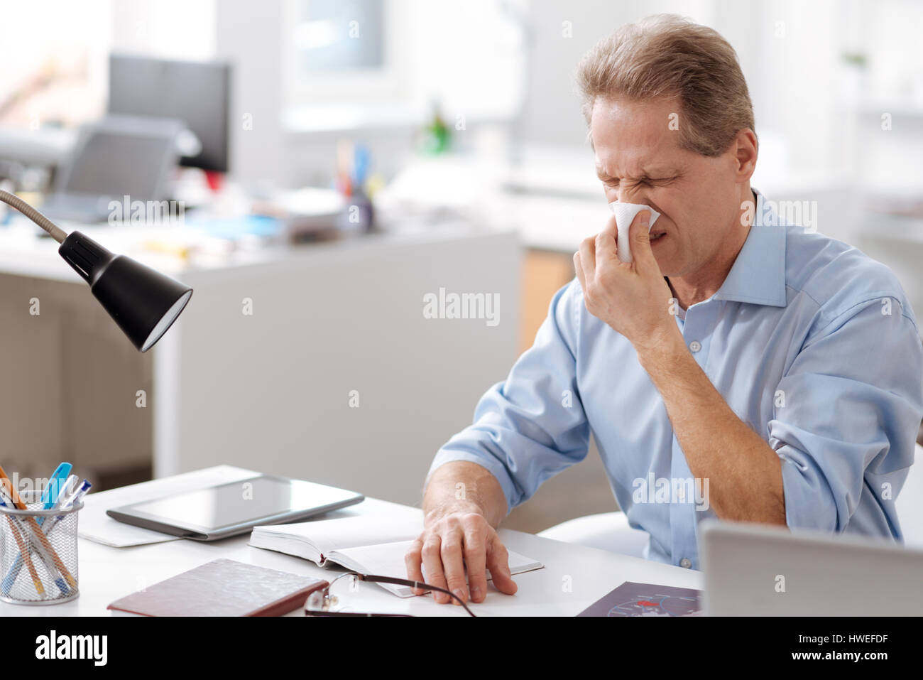 Photo of sick man having nasal problems Stock Photo - Alamy