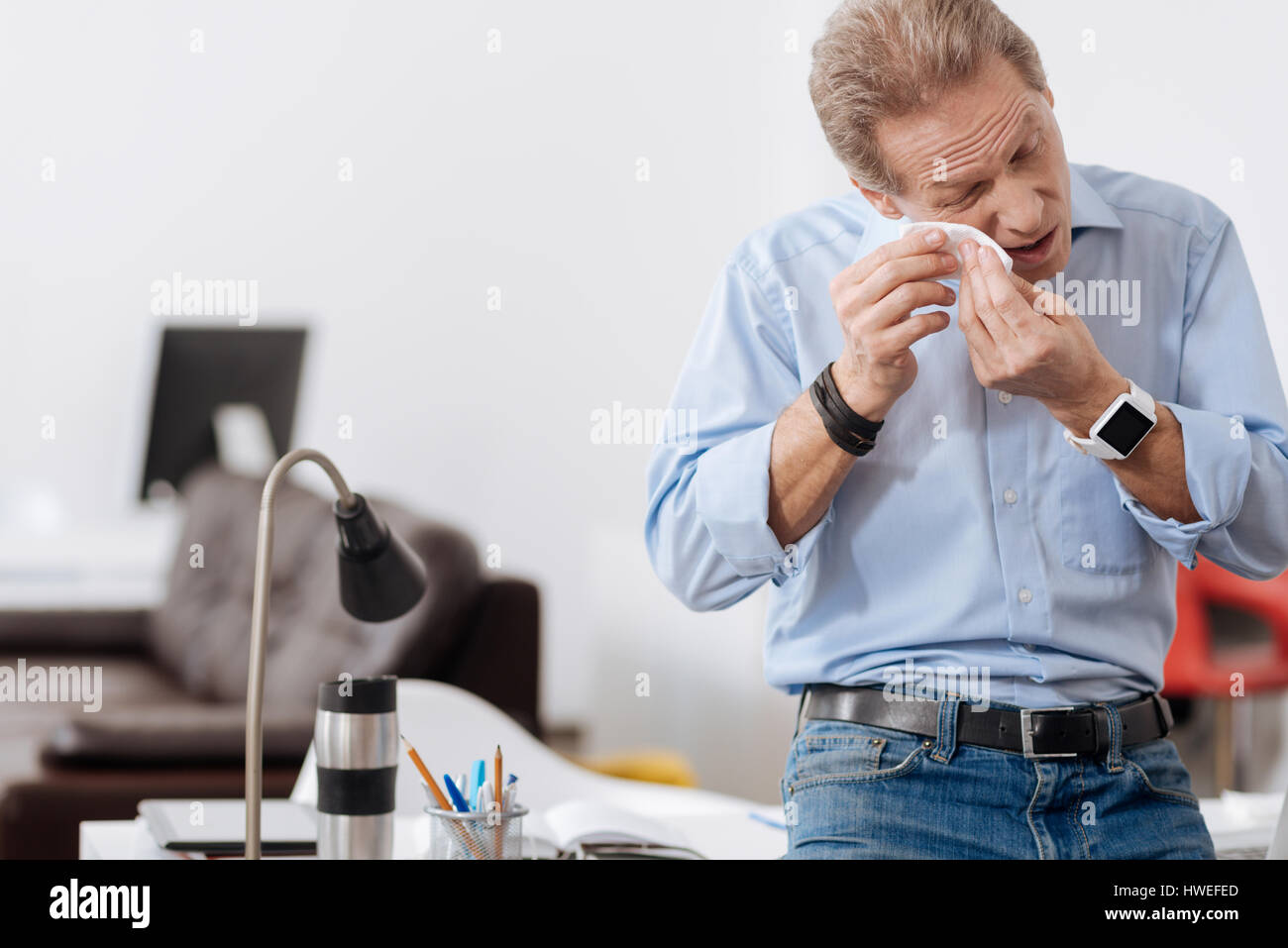 Sad male person bowing his head Stock Photo - Alamy