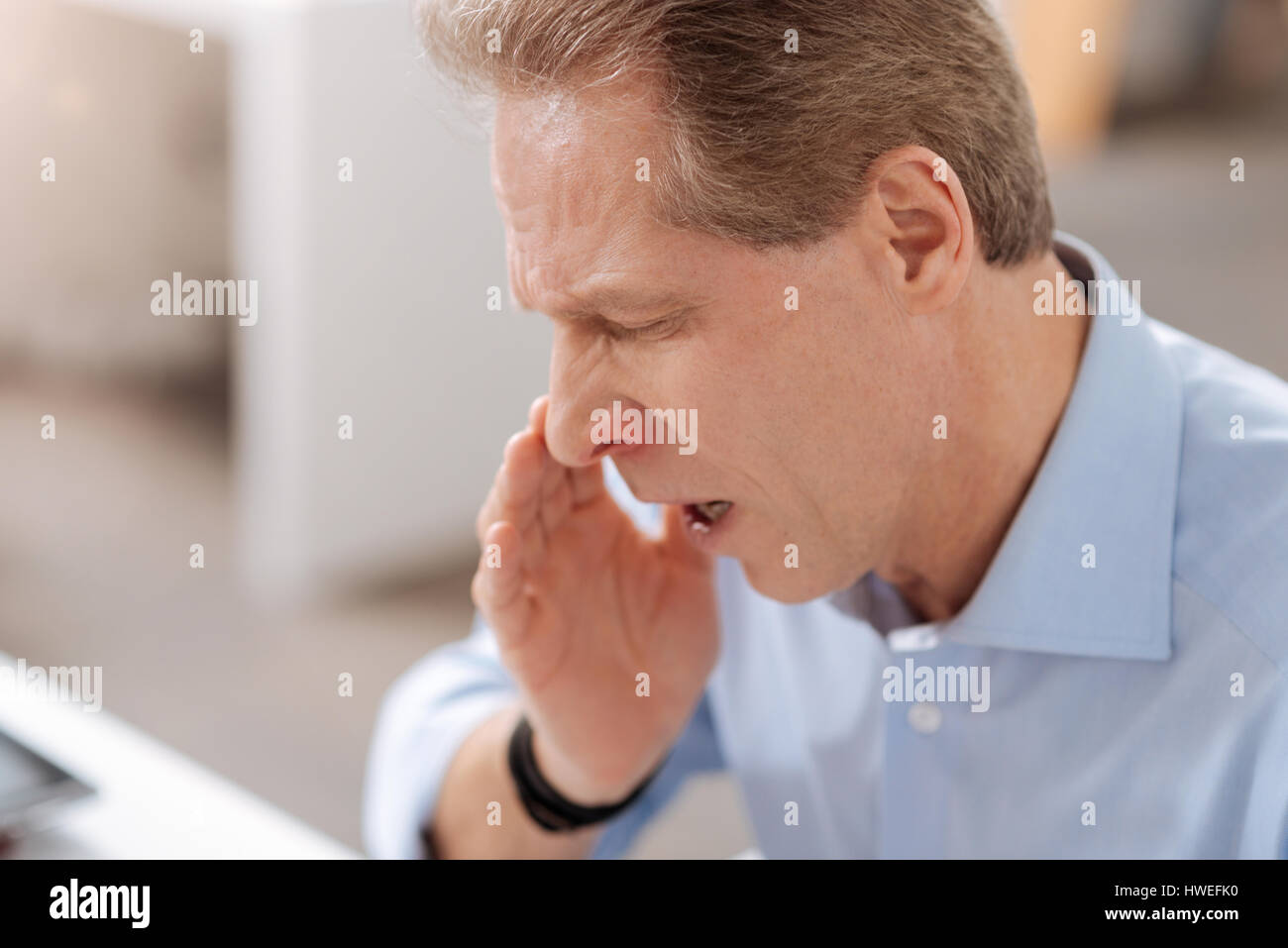 Profile of disturbed man keeping eyes closed Stock Photo - Alamy