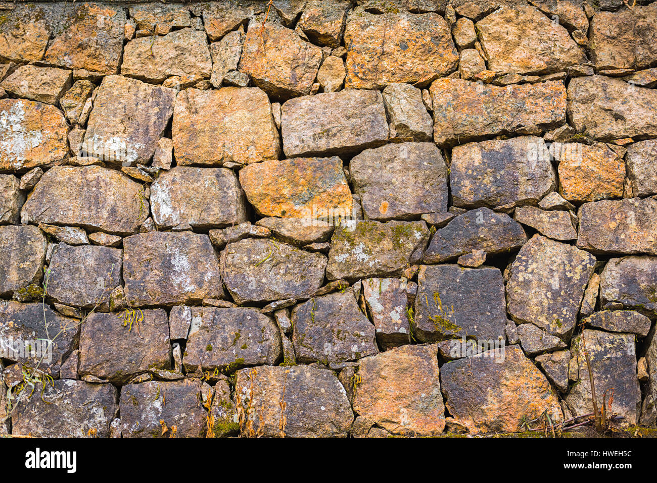 old weathered stone brown wall background in India, close up Stock ...