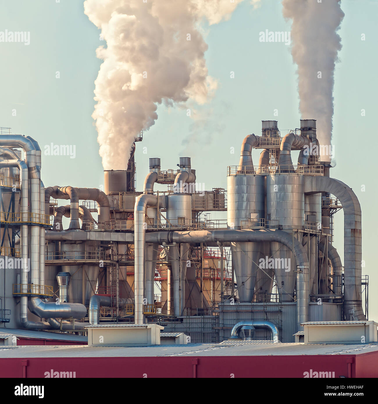 Chemical plant. Silos and smokestacks of a factory Stock Photo - Alamy