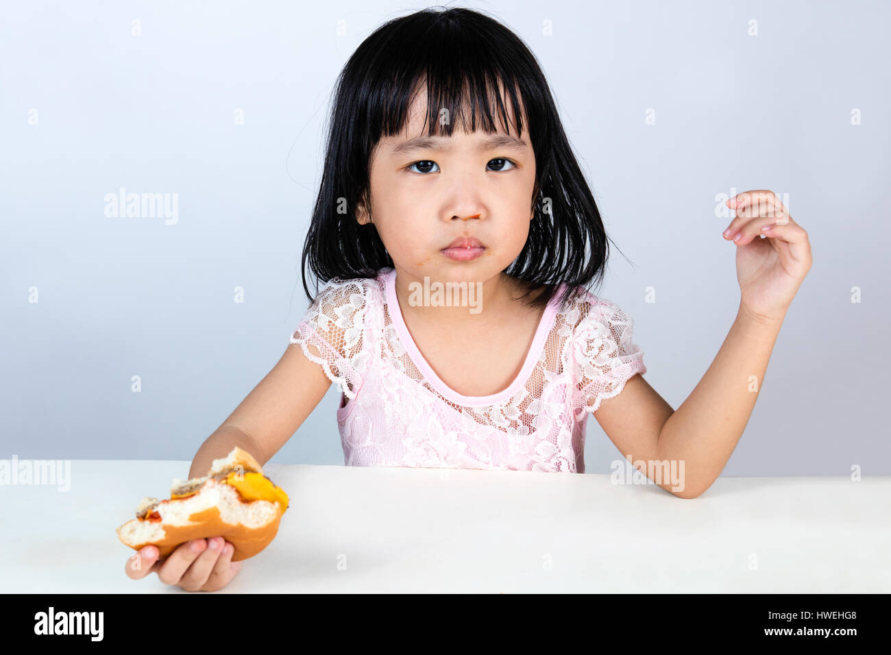 Asian Chinese little girl Refusing Eating Burger with clean isolated ...