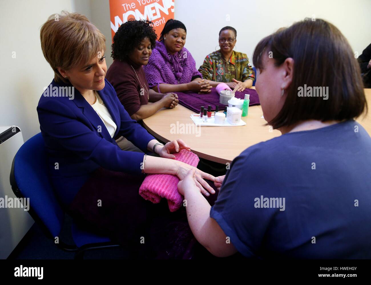 First Minister Nicola Sturgeon has her hand and arm massaged by Natalie ...