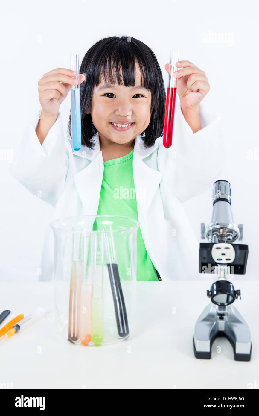 Happy Asian Chinese Little Girl Examining Test Tube With Uniform in ...