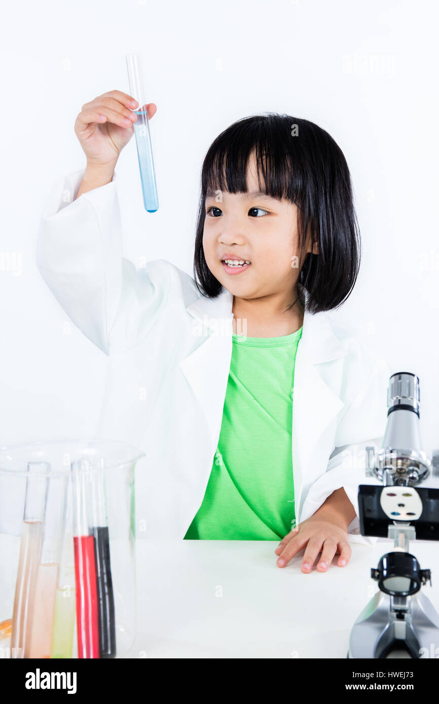 Asian Chinese Little Girl Examining Test Tube With Uniform in isolated ...
