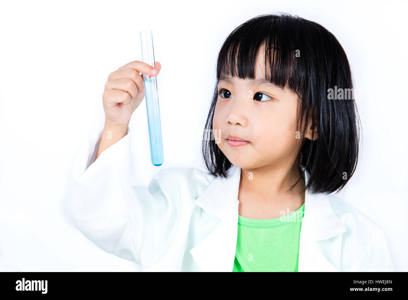Smiling Asian Chinese Little Girl Examining Test Tube With Uniform in ...