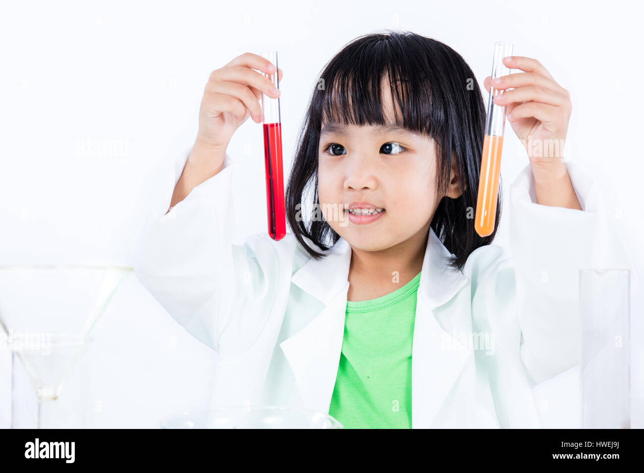 Smiling Asian Chinese Little Girl Examining Test Tube With Uniform in ...