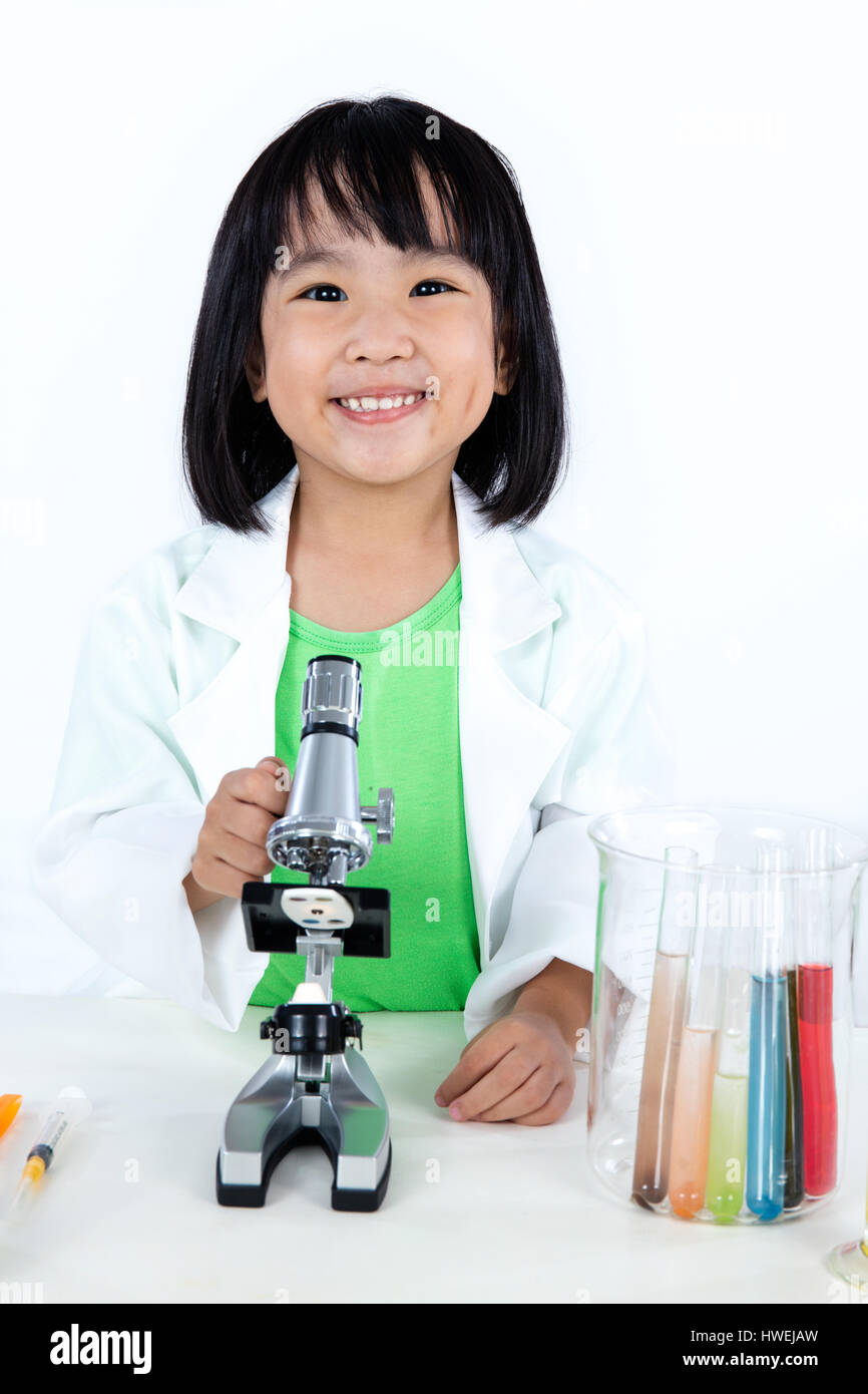 Smiling Asian Chinese Little Girl Working With Microscope in isolated ...