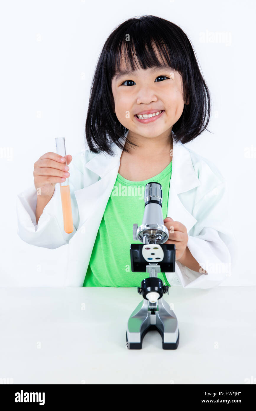 Happy Asian Chinese Little Girl Examining Test Tube With Uniform in ...