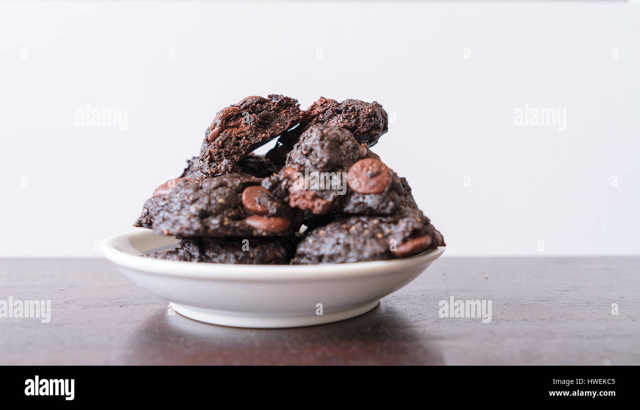 Stack of Vegan chocolate brownie cookie on white round plate Stock ...