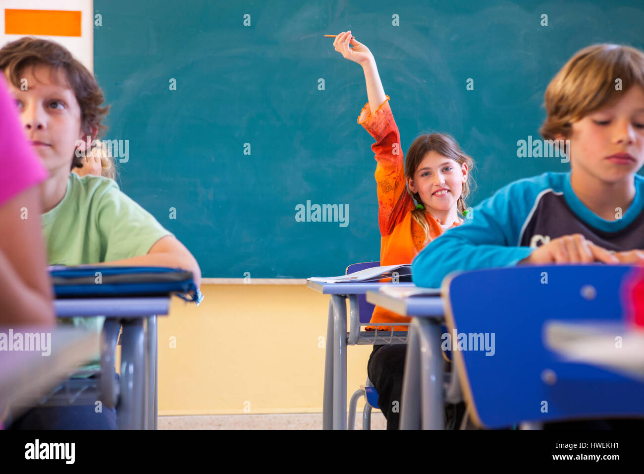 Hand raised and classroom hi-res stock photography and images - Alamy