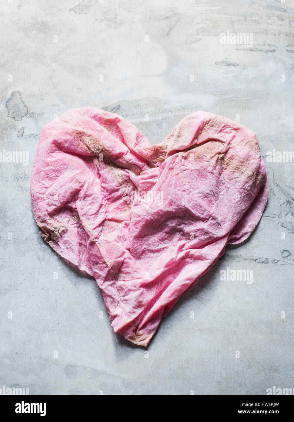 Studio shot, overhead view of pink heart shaped cloth Stock Photo - Alamy