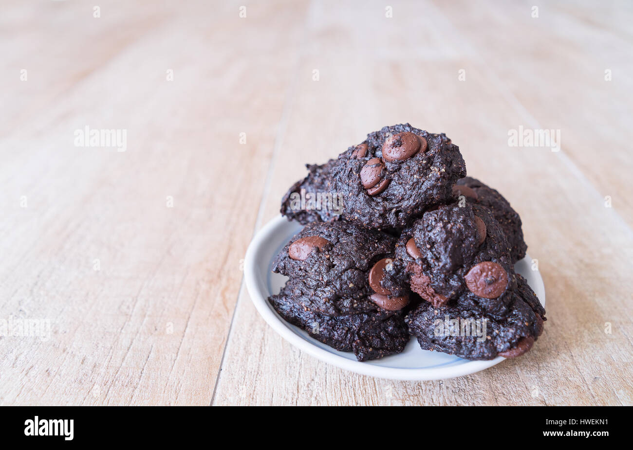 Stack of Vegan chocolate brownie cookie on white round plate Stock ...