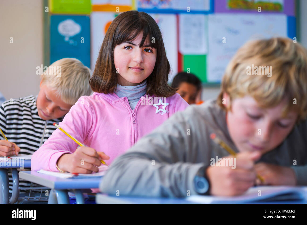 Girl doing classwork hi-res stock photography and images - Alamy